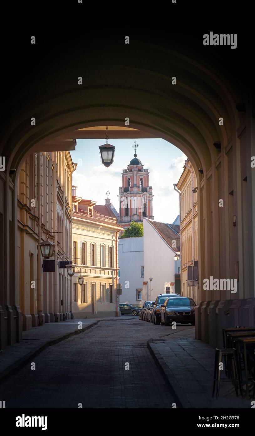 Street view and Church of All Saints tower - Vilnius, Lithuania Stock ...