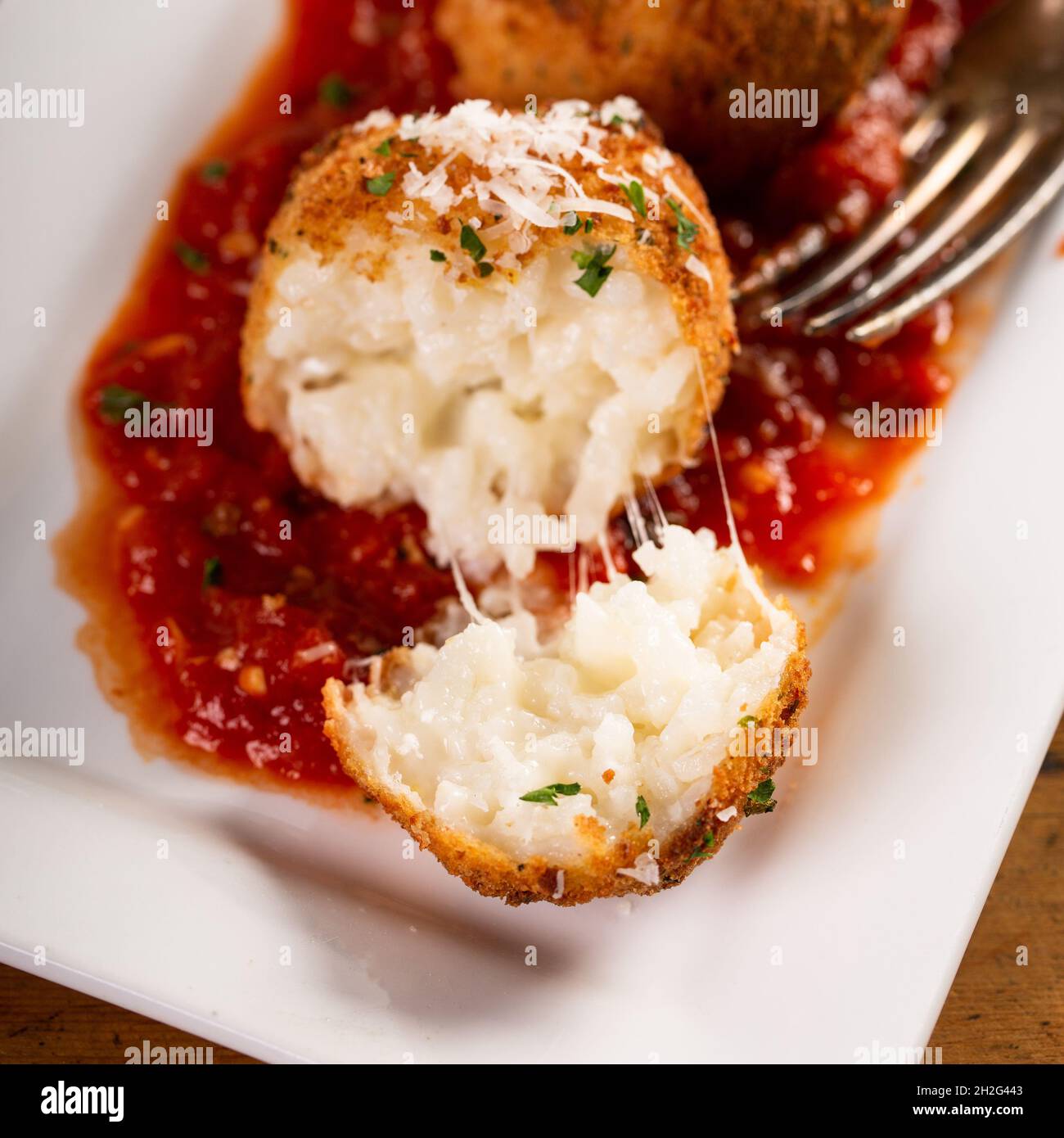 Mozzarella arancini, stuffed rice balls, italian appetizer Stock Photo ...