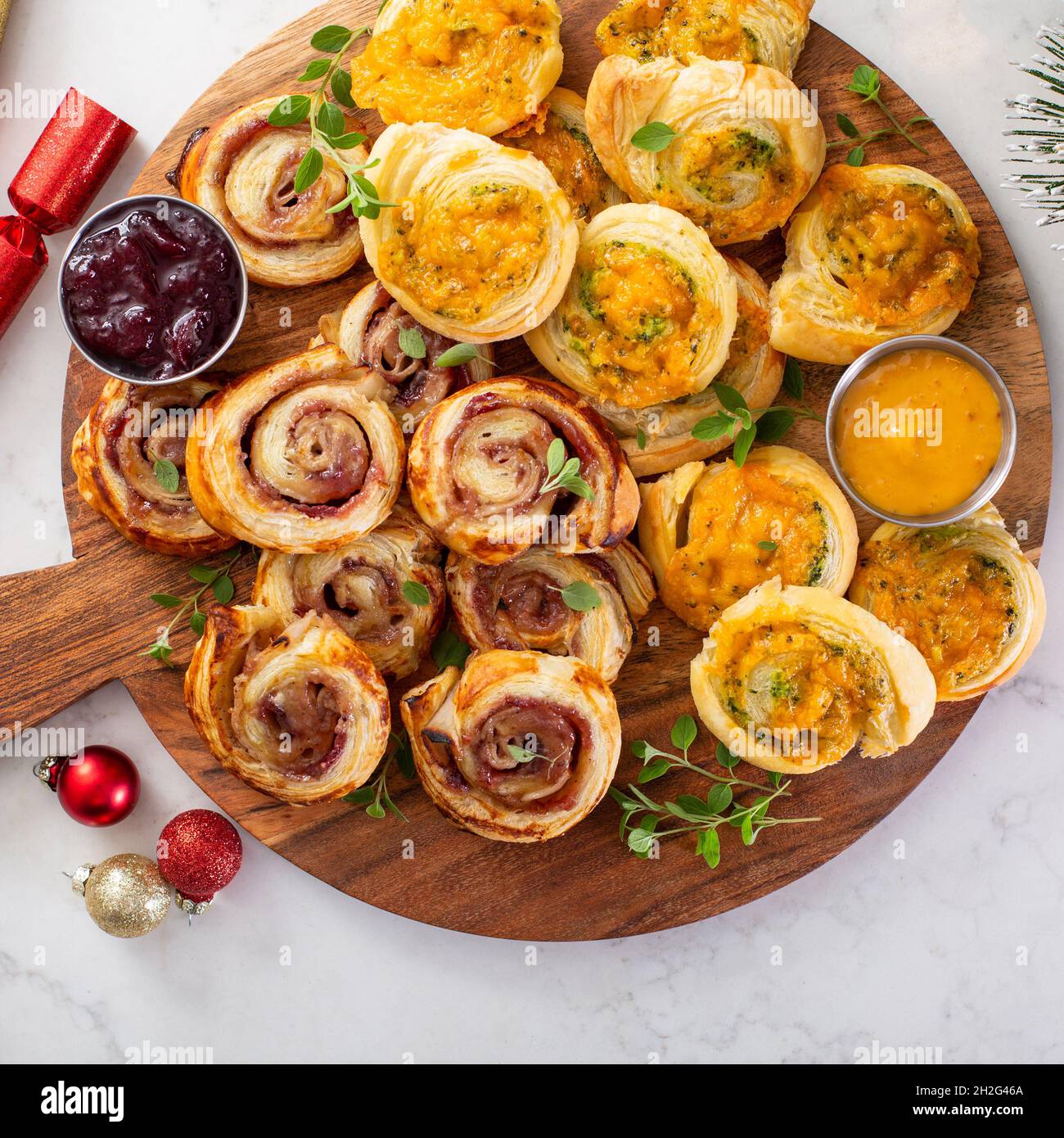 Christmas appetizers, puff pastry wheels filled with cheese and jam ...