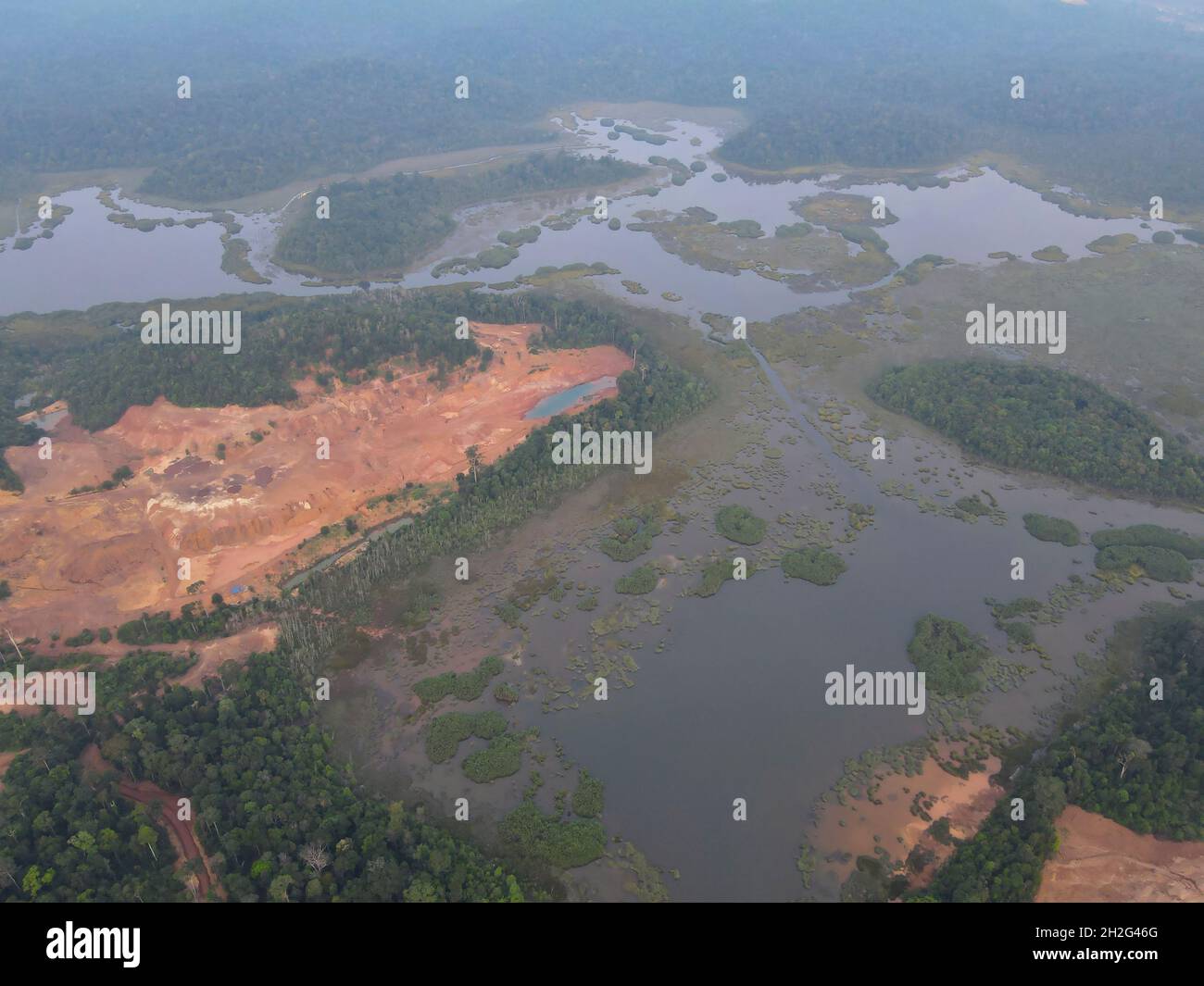 Aerial view of Lake Chini showing the lake and the mining area adjacent ...