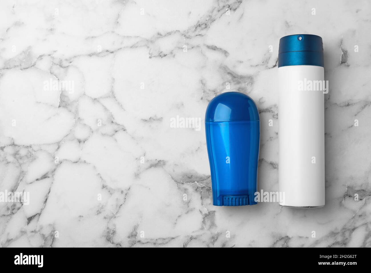 Different deodorants on marble background, top view. Skin care Stock ...