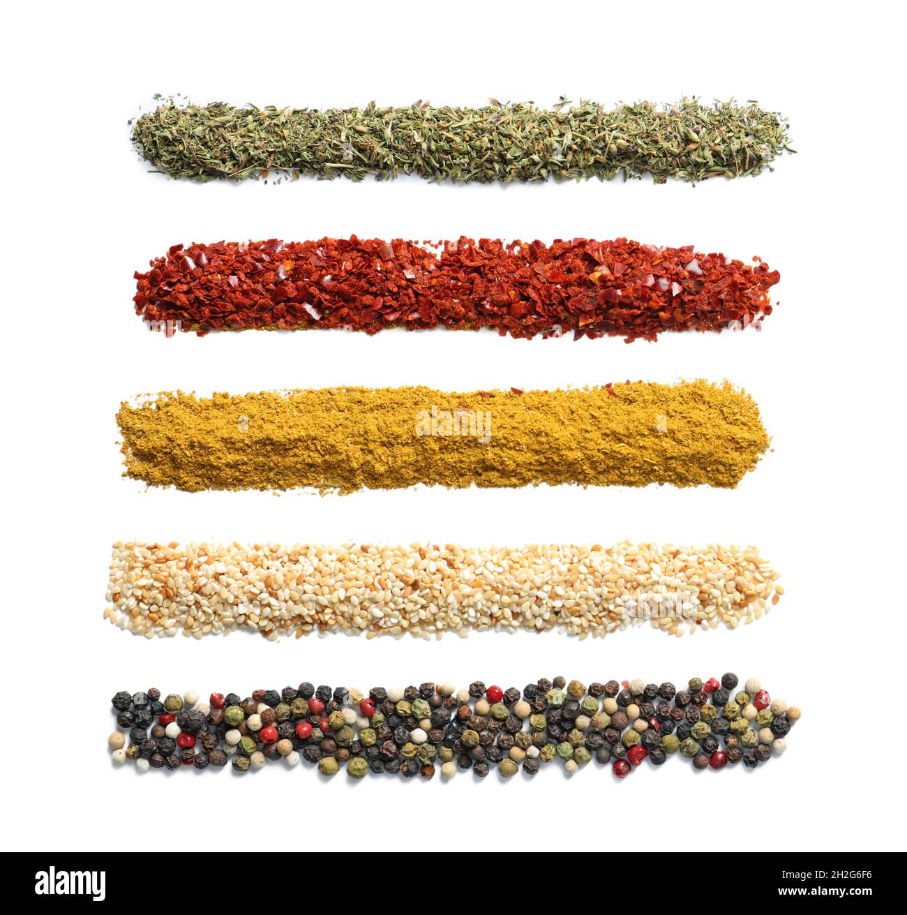 Rows of different aromatic spices on white background, top view with ...