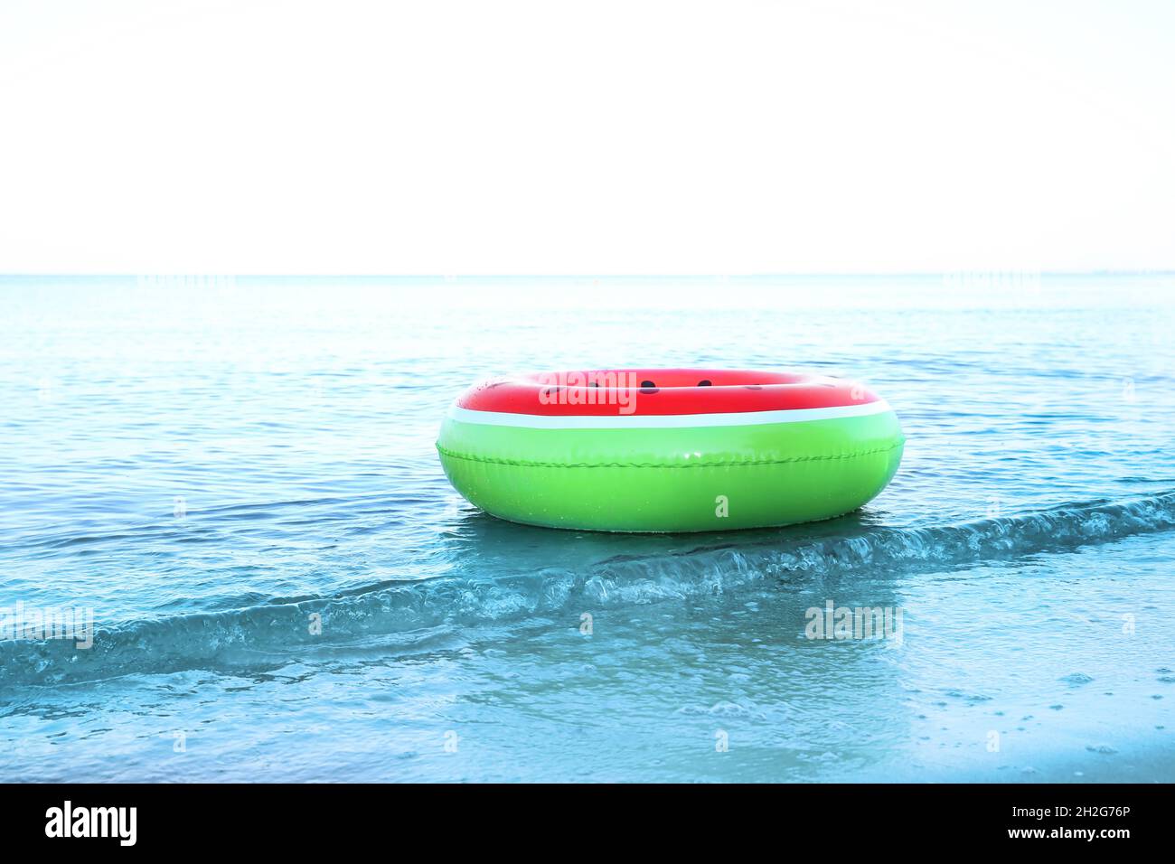 Colorful inflatable ring floating on sea water. Summer vacation Stock ...