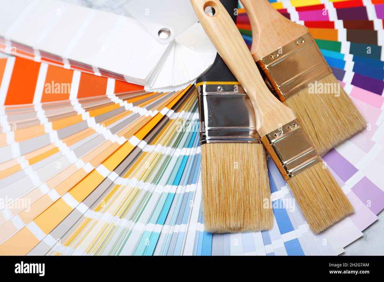 Closeup view of brushes and paint color palette samples Stock Photo - Alamy