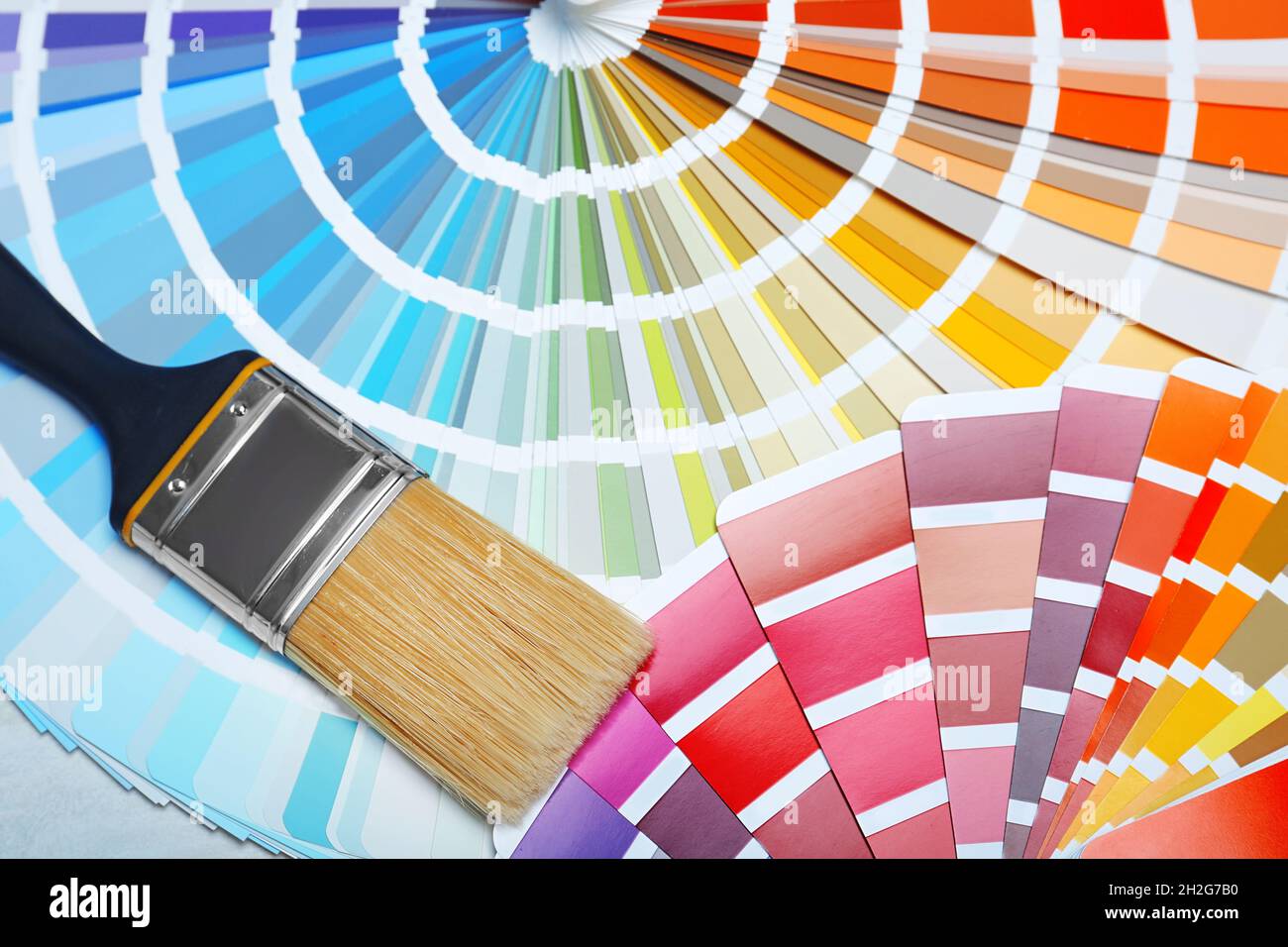 Closeup view of brush and paint color palette samples Stock Photo - Alamy