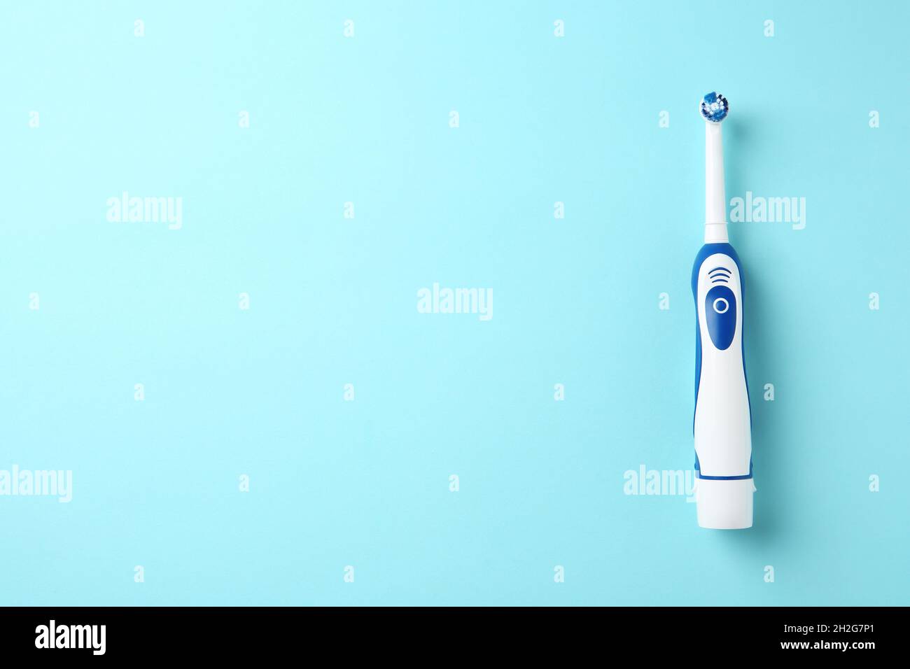 Electric toothbrush on color background. Dental care Stock Photo - Alamy