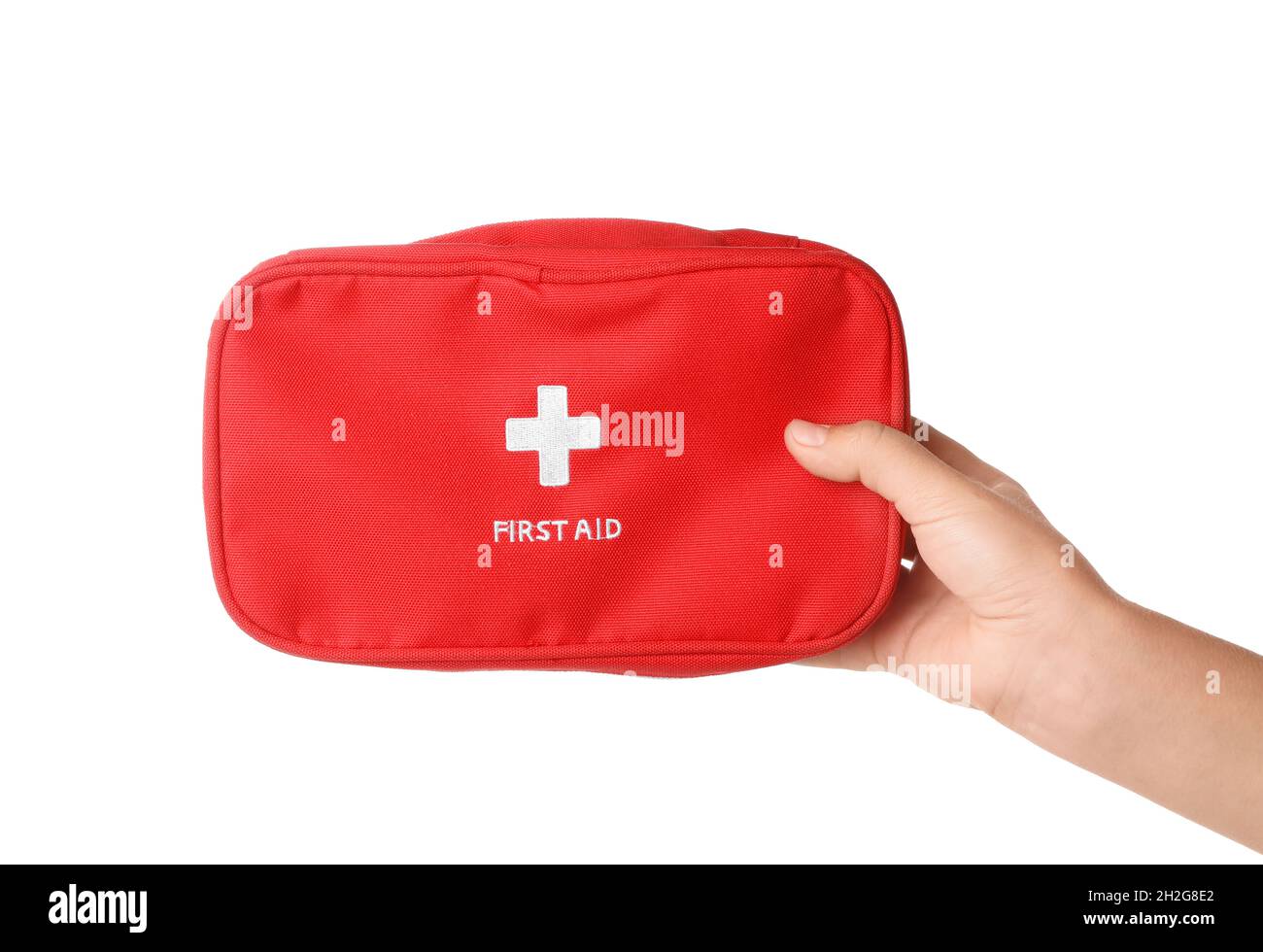 Woman holding first aid kit on white background Stock Photo - Alamy