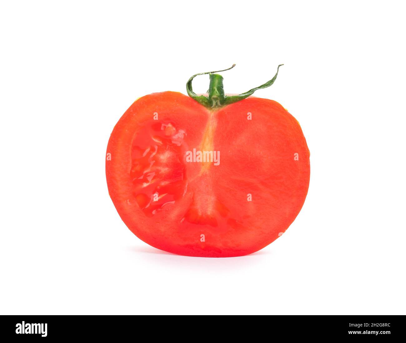 Cut ripe red tomato on white background Stock Photo - Alamy