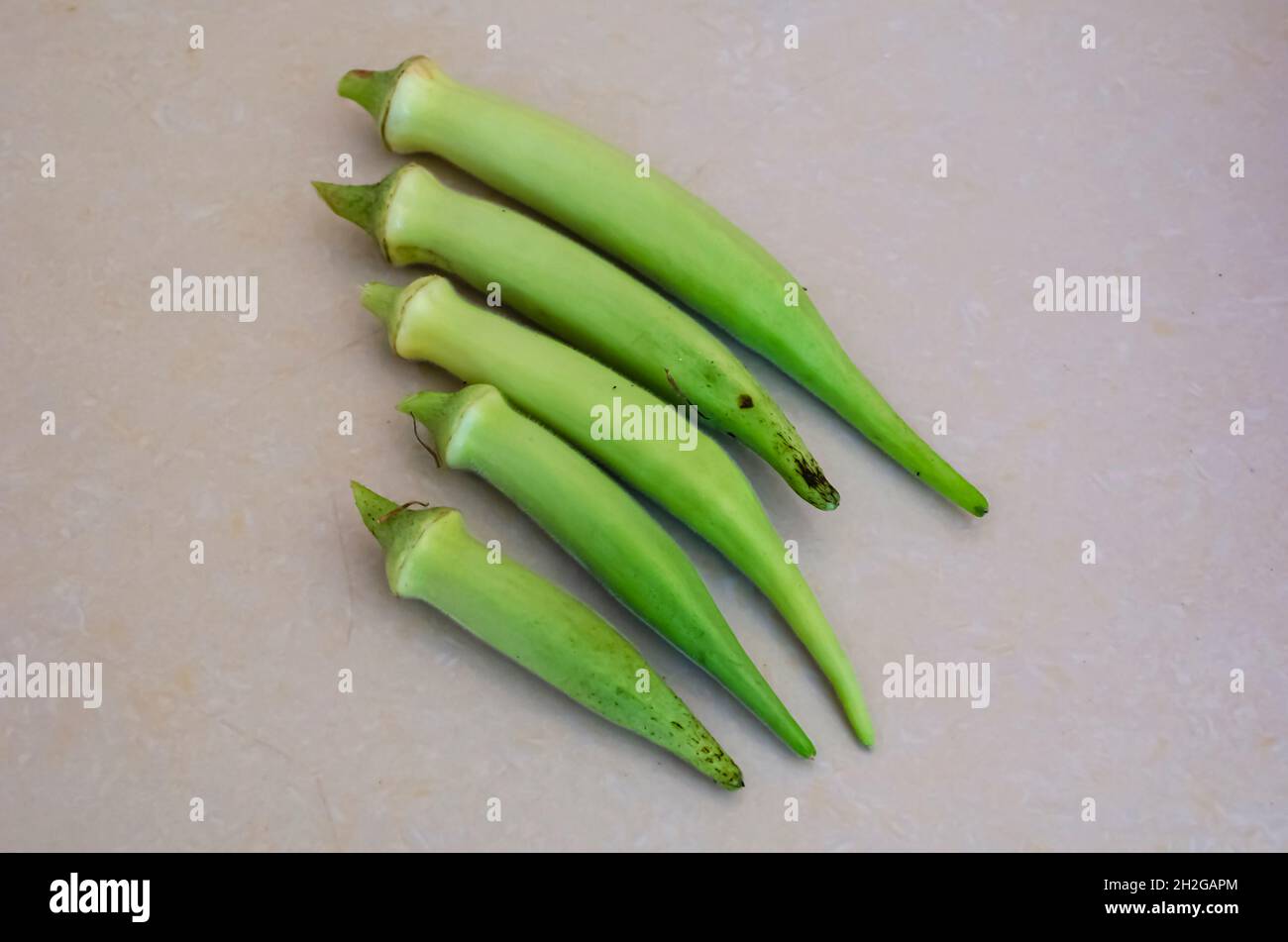Mature Okra On White Surface Stock Photo - Alamy