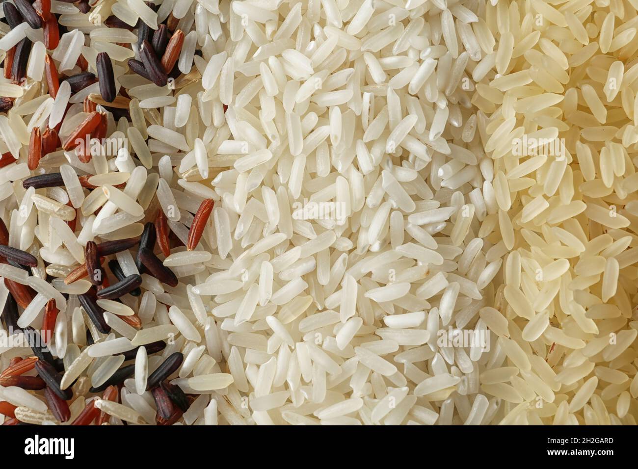 Brown and other types of rice as background, closeup Stock Photo - Alamy