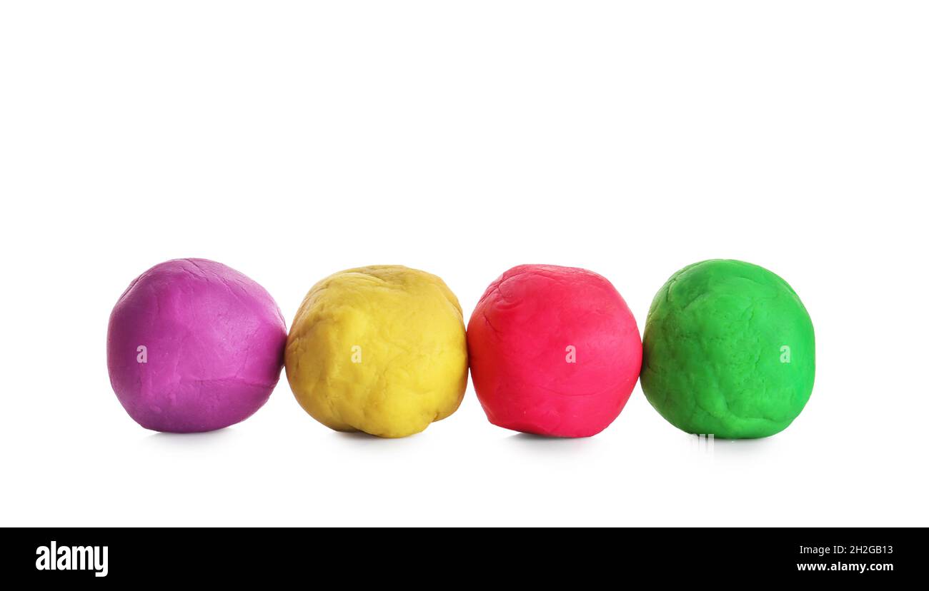 Colorful play dough on white background Stock Photo - Alamy