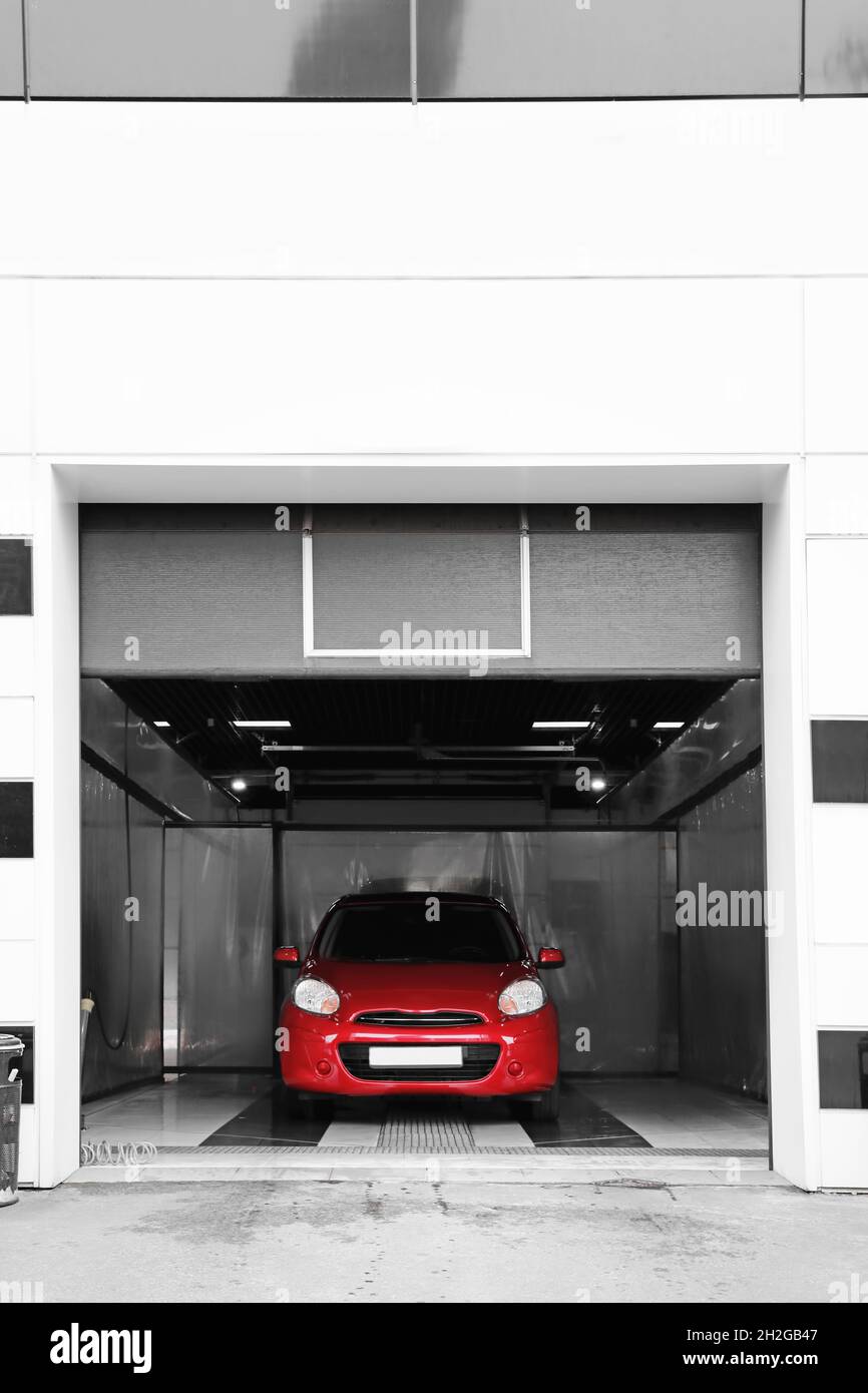 Red auto at car wash. Cleaning service Stock Photo - Alamy