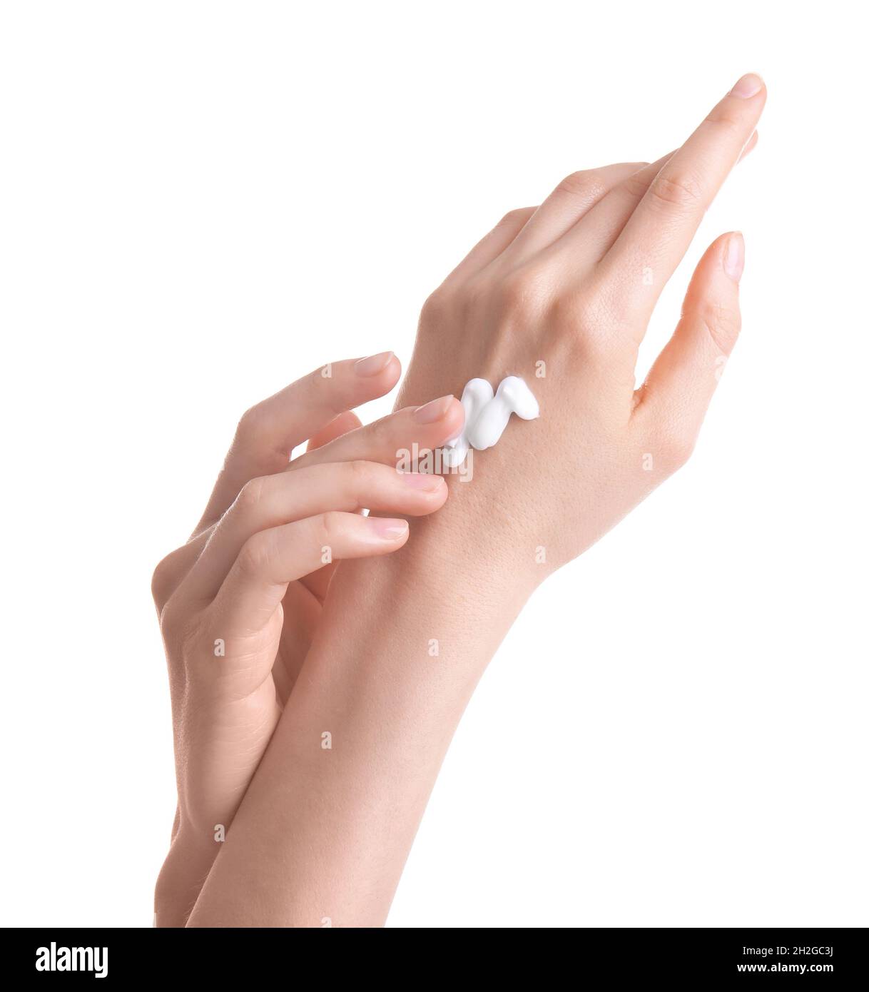 Young woman applying hand cream against on white background Stock Photo ...