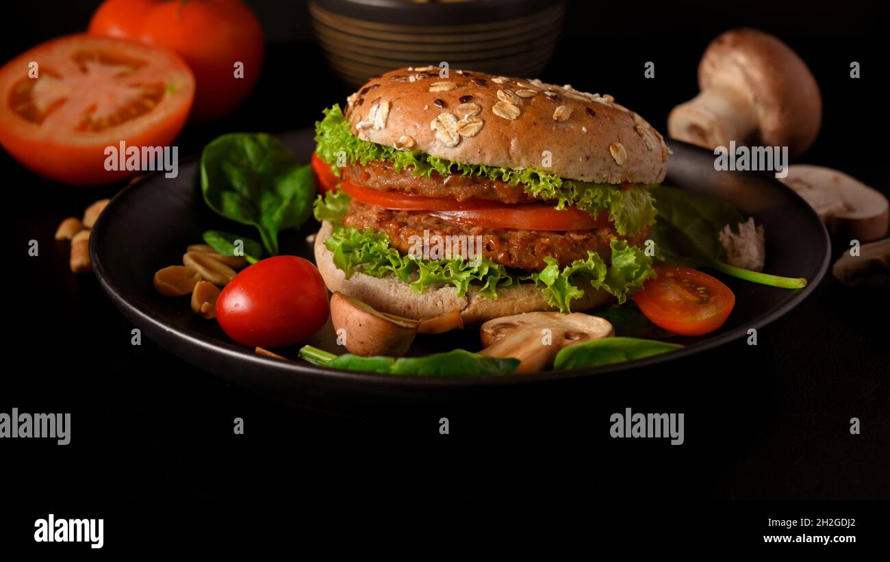Tasty juicy vegan meat burger with fresh vegetables and special sauce ...