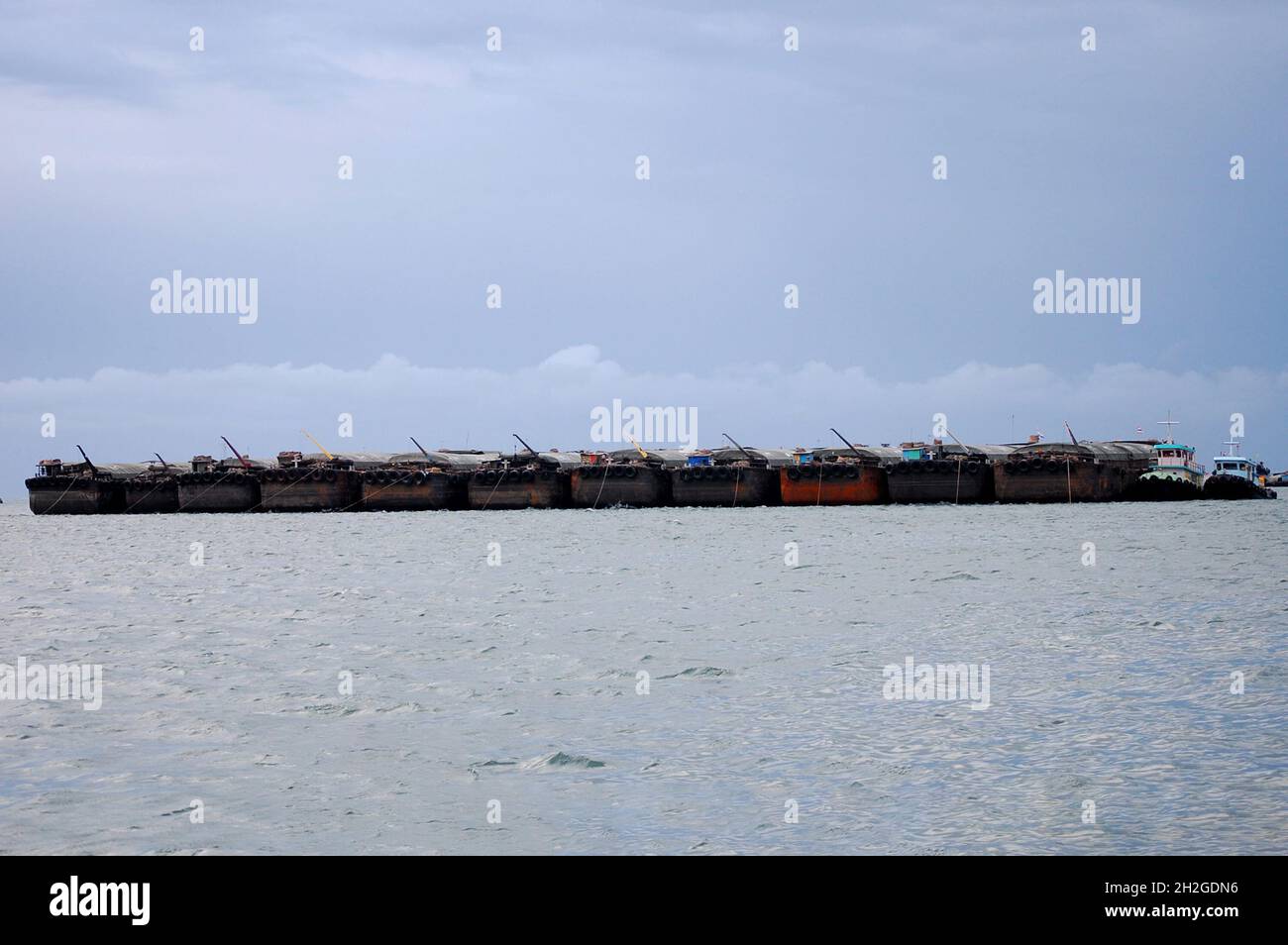 Freighter cargo ship floating in sea ocean wait queue transfer goods ...
