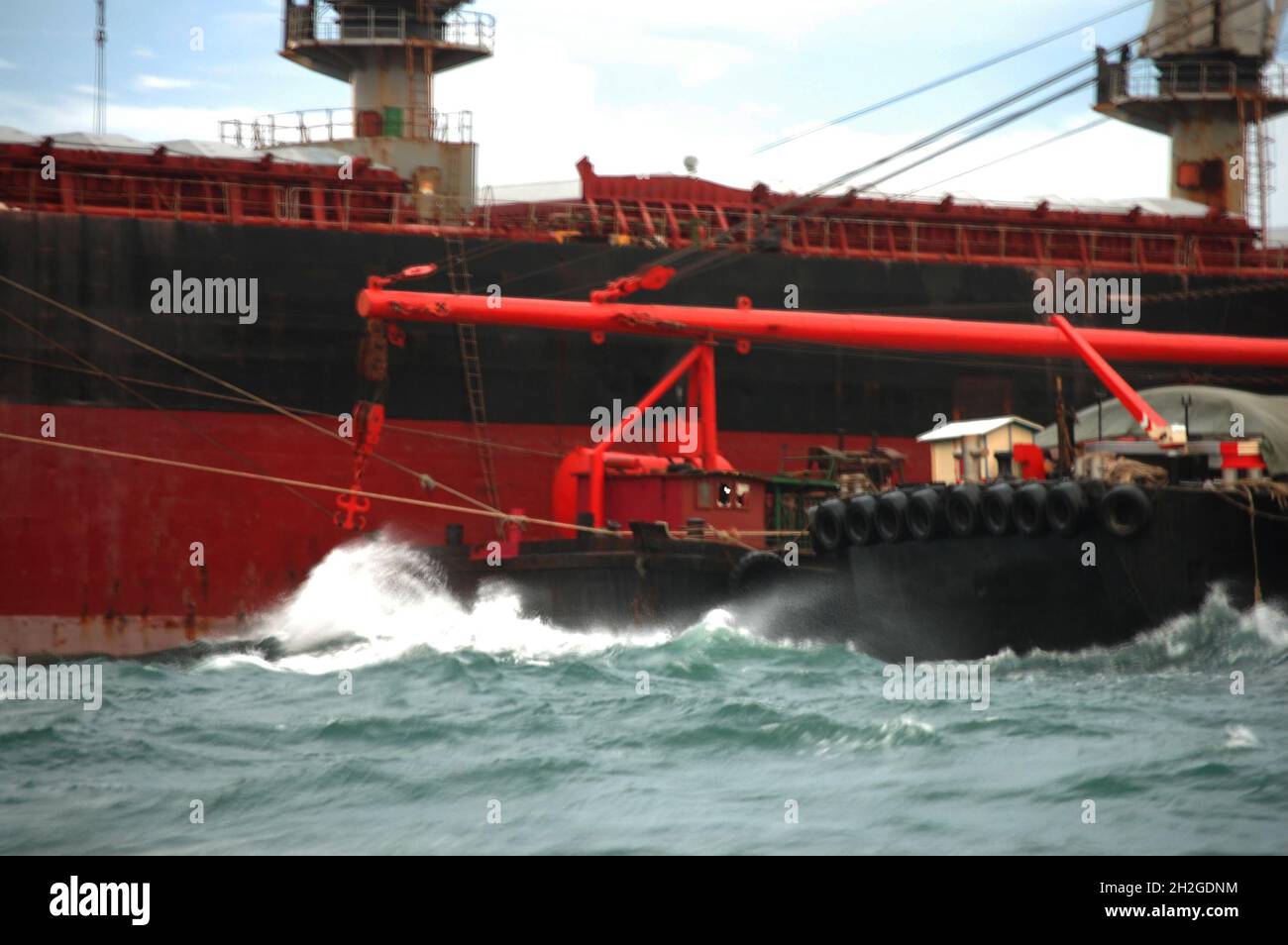 Freighter cargo ship floating in sea ocean wait queue transfer goods ...