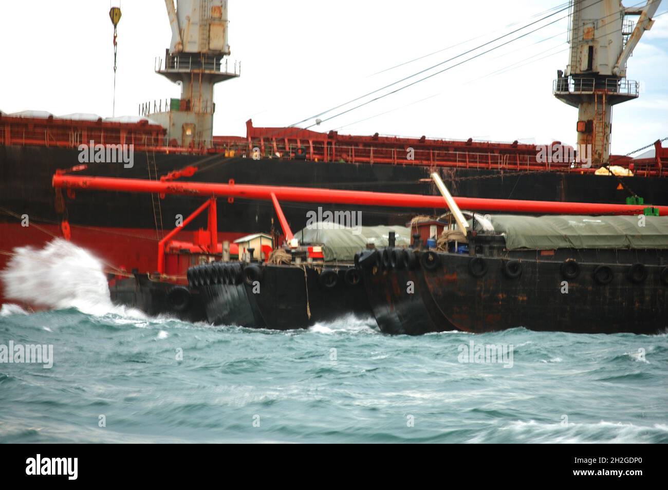 Freighter cargo ship floating in sea ocean wait queue transfer goods ...