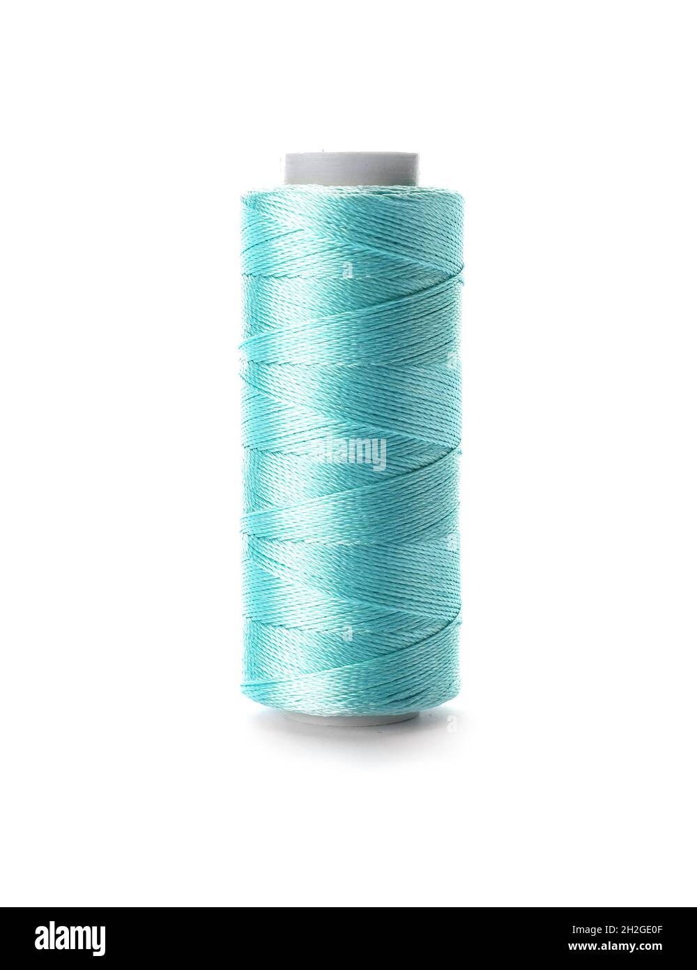 Color sewing thread on white background Stock Photo - Alamy