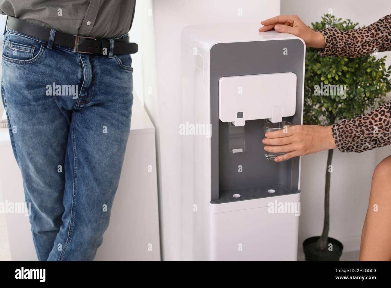 Watercooler talk hi-res stock photography and images - Alamy