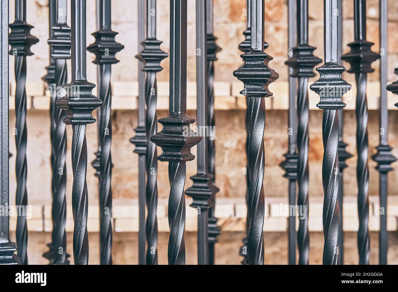 Welded metal balusters group dries after painting black color hanging ...