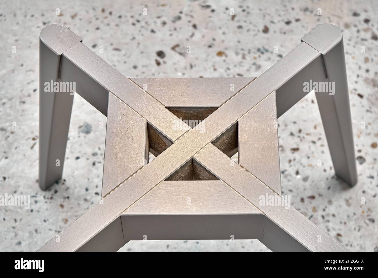 Wooden base with simple legs of gray color for elegant chairs ...