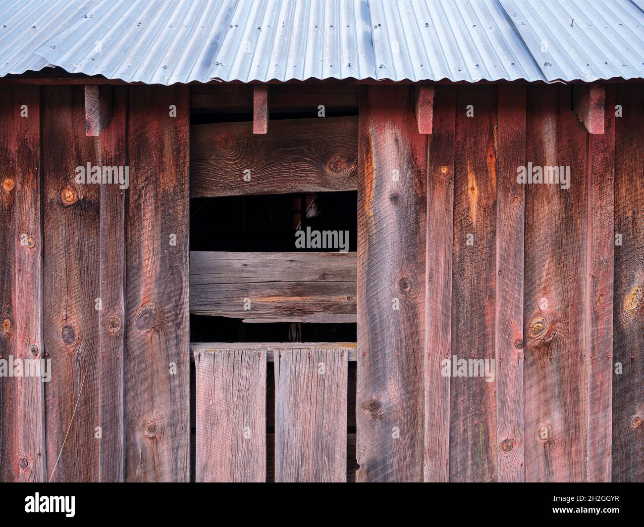 A window frame on the side of an old barn Stock Photo - Alamy