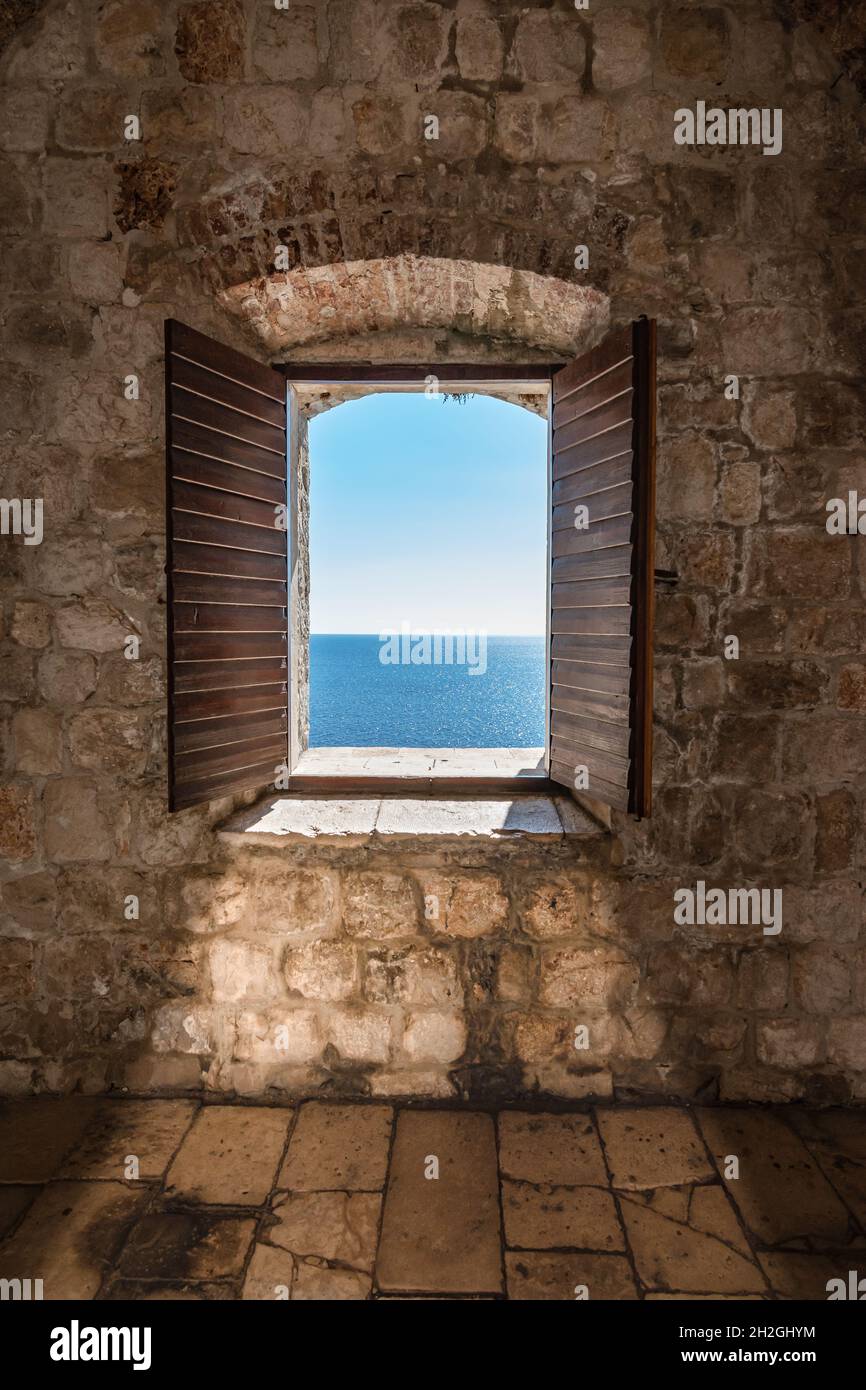 Sunlight shines through the open window overlooking the sea Stock Photo ...