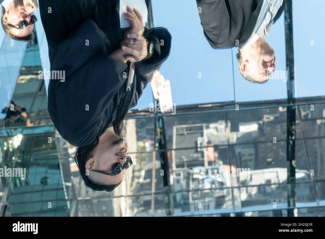 New York, NY - October 21, 2021: Reflection of Artist Kenzo Digital ...