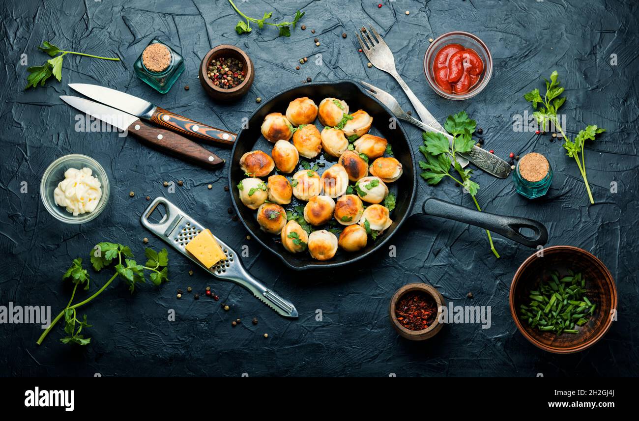 Frying pan with roasted tasty pelmeni.Fried dumplings Stock Photo - Alamy