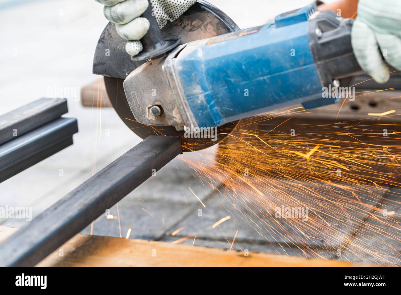 working with a circular saw cutting metal close-up Stock Photo - Alamy