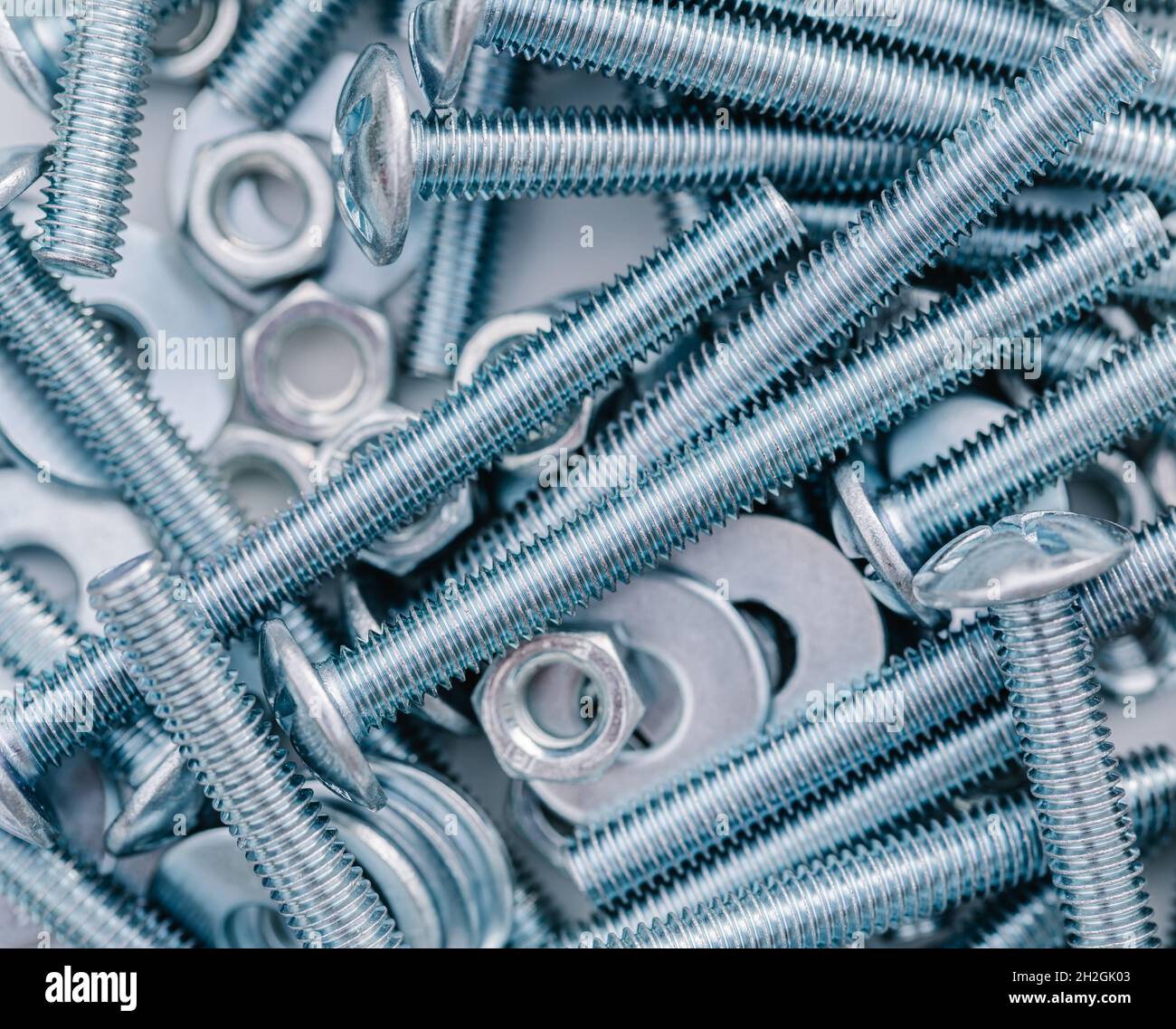 background of new bolts and nuts close-up Stock Photo - Alamy