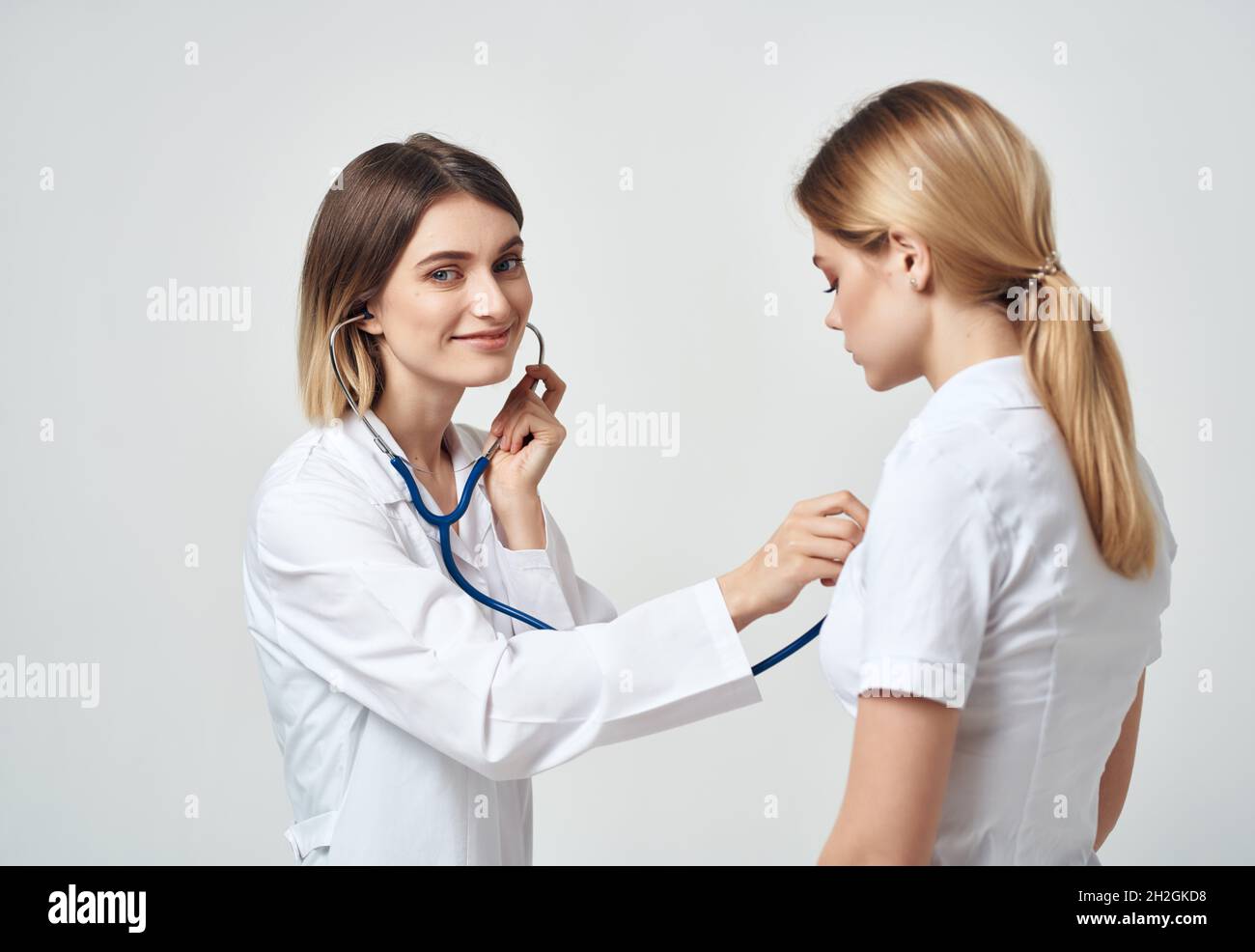 doctor patient examination health care light background Stock Photo - Alamy