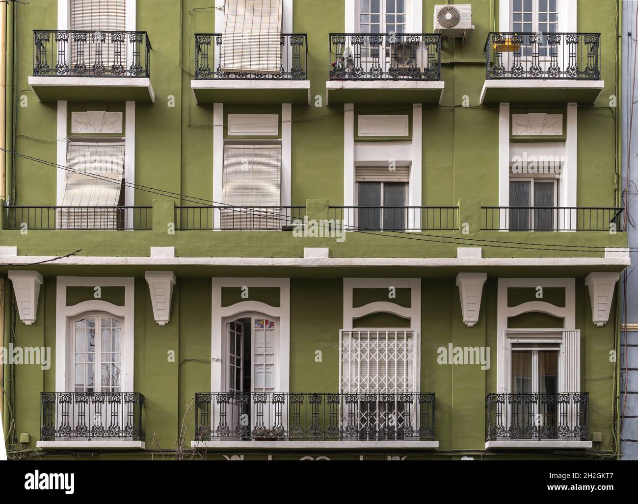 several windows of old apartment residential building of the early ...
