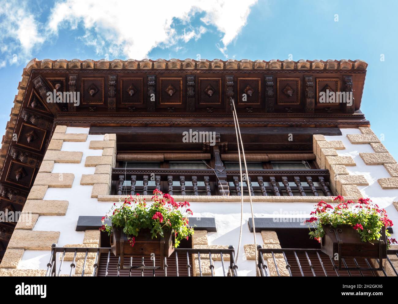 Old Spanish building classic house 16th century, balcony ornate wooden ...