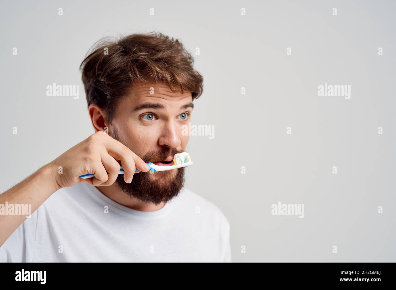 man toothbrush in hand hygiene clean teeth isolated background Stock ...