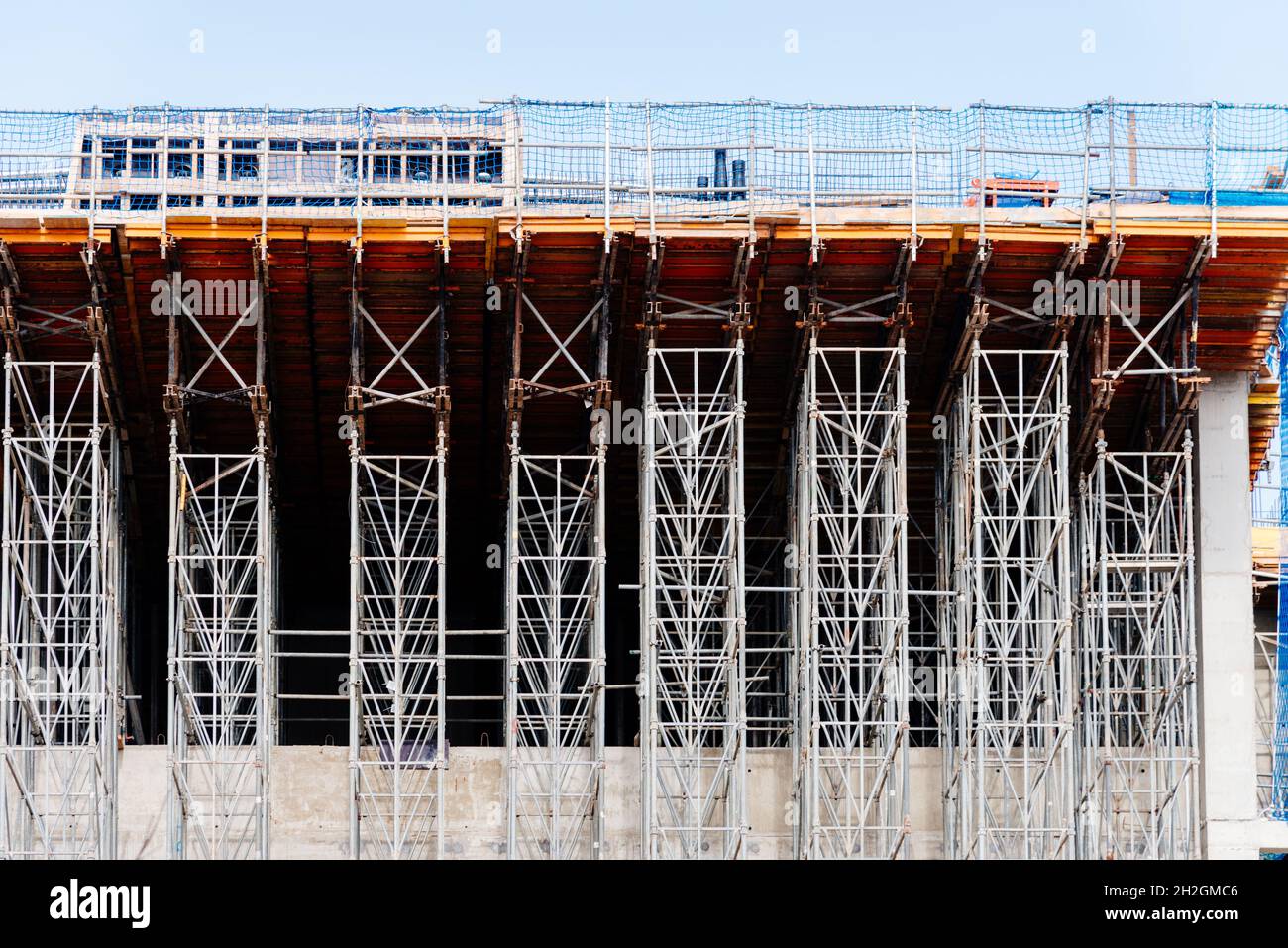 Scaffolding in construction site of modern office building. Engineering ...