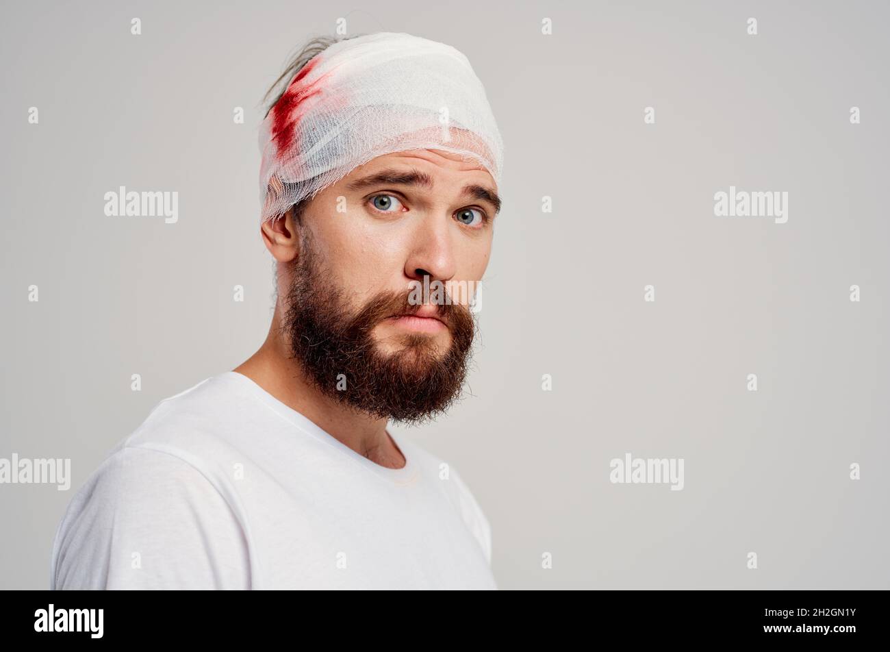 bearded man head and arm injuries health problems isolated background ...