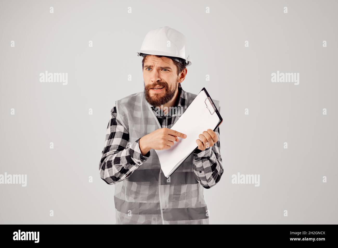 engineer with documents and drawings blueprints light background Stock ...