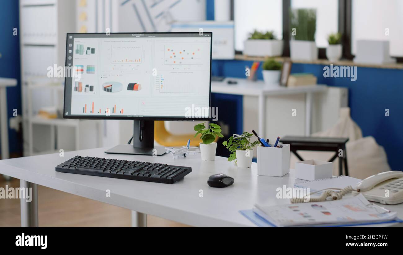 Nobody at desk in company office with computer and tools. Empty ...