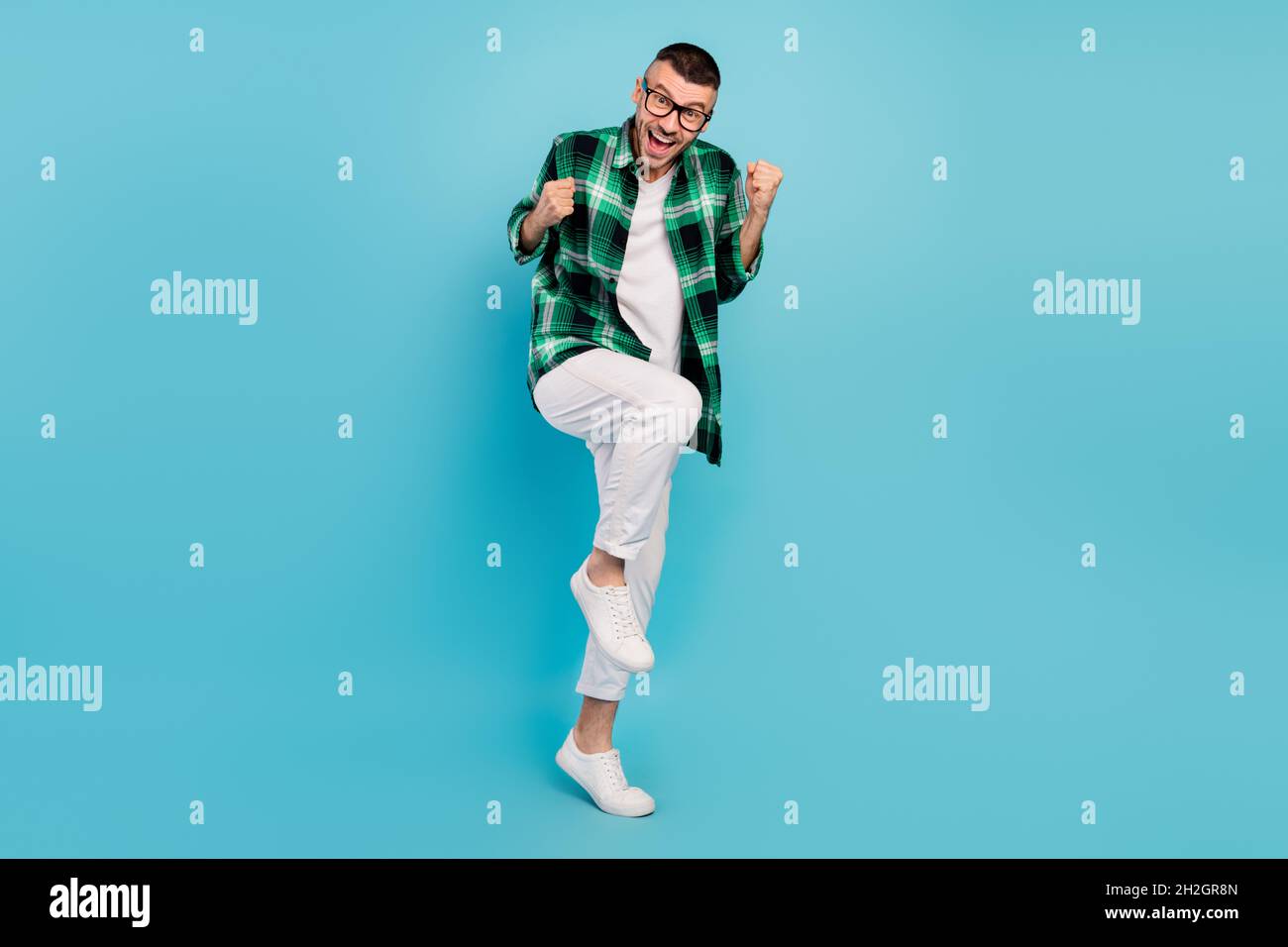 Full length body size man gesturing like winner in stylish outfit ...