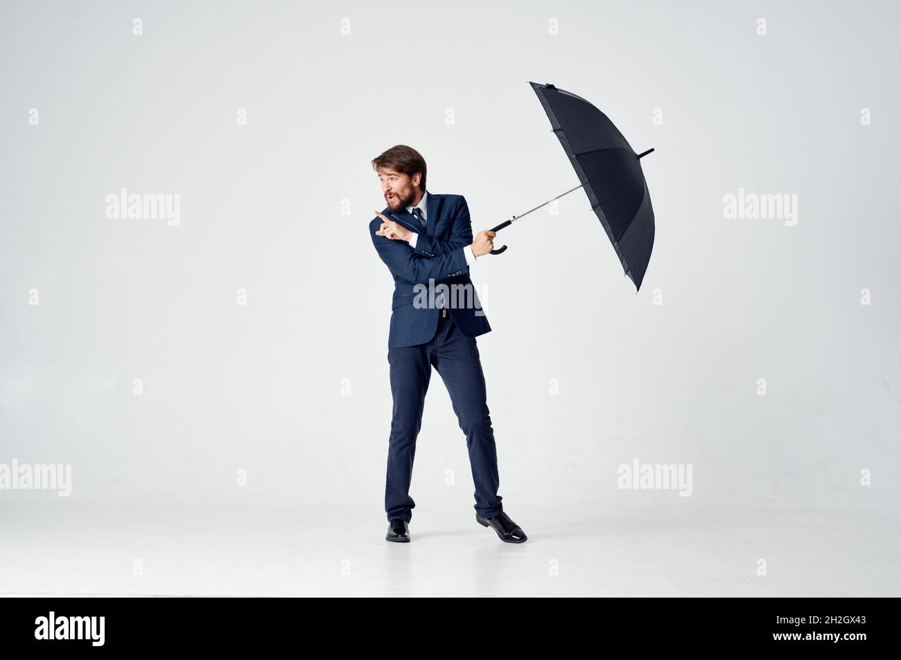 business man in a suit manager office work umbrella in hand Stock Photo ...