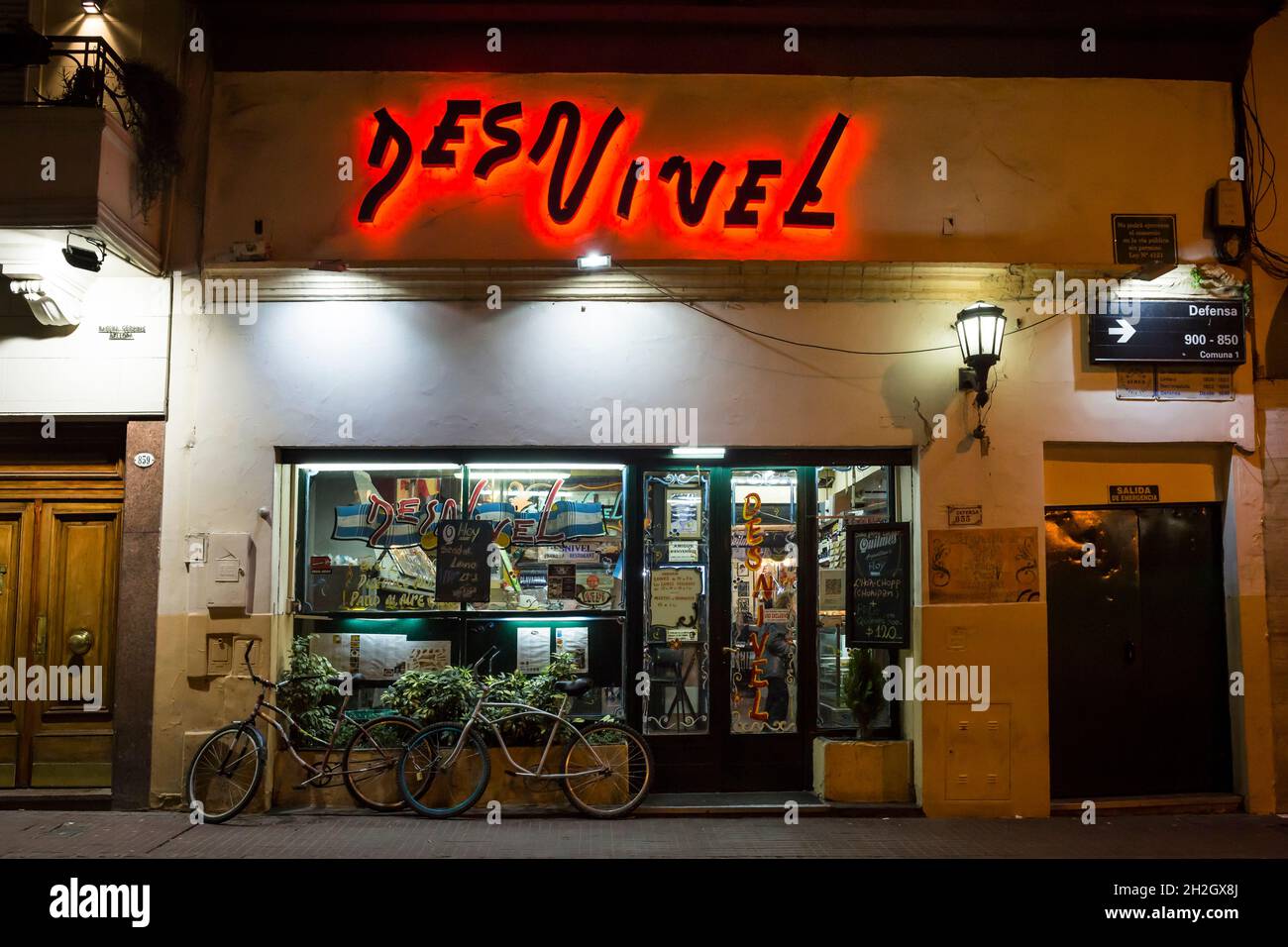 Horizontal night view of the illuminated Desnivel Restaurant exterior ...