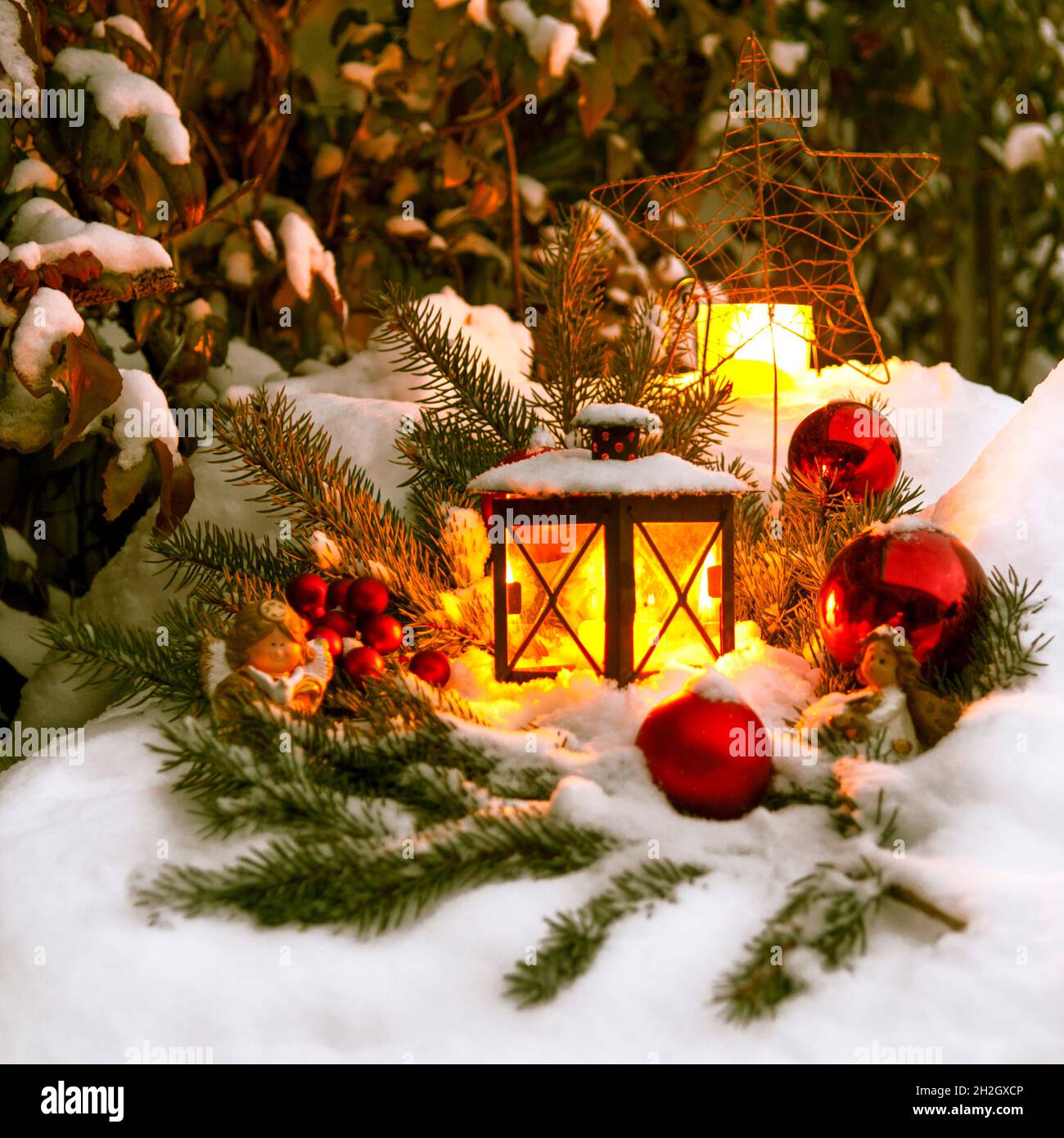 Still life: lantern with candlelight in wintry nature Stock Photo - Alamy
