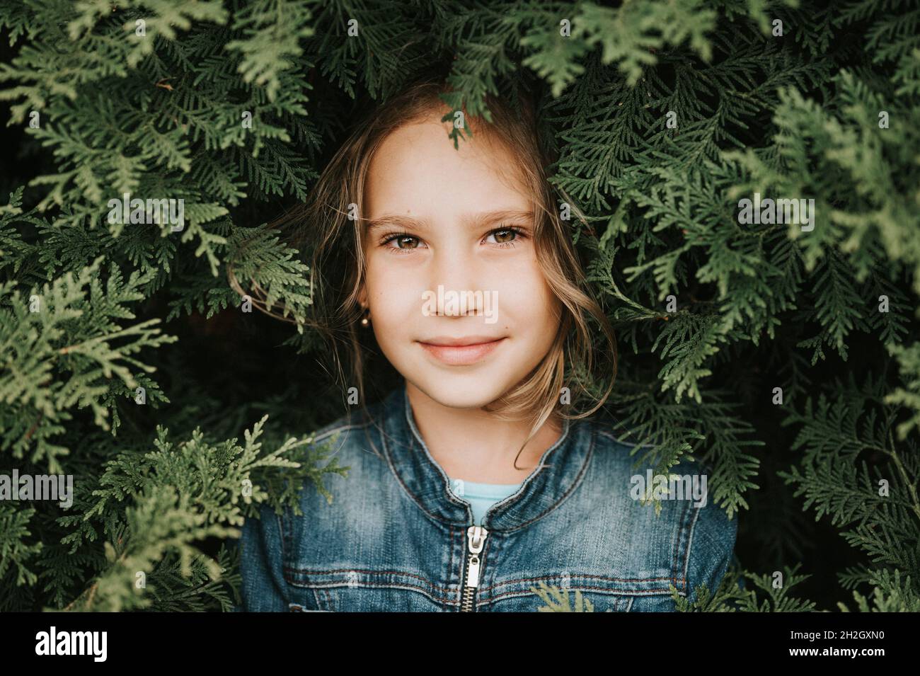 portrait of the face of a cute happy caucasian candid healthy eight ...