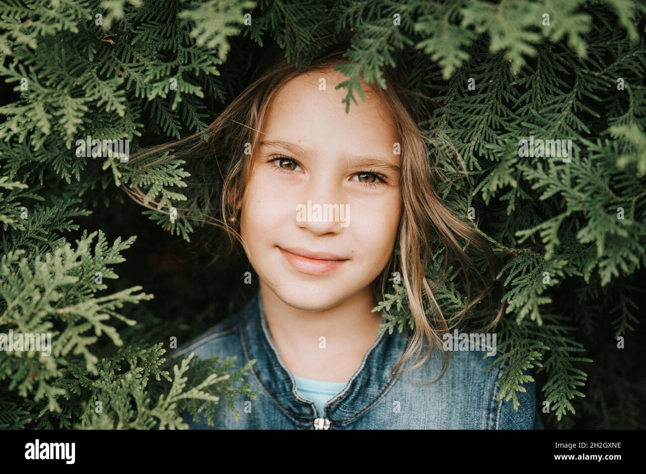 portrait of the face of a cute happy caucasian candid healthy eight ...