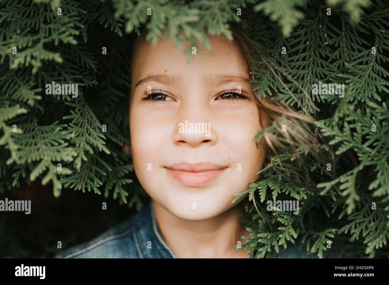 portrait of the face of a cute happy caucasian candid healthy eight ...