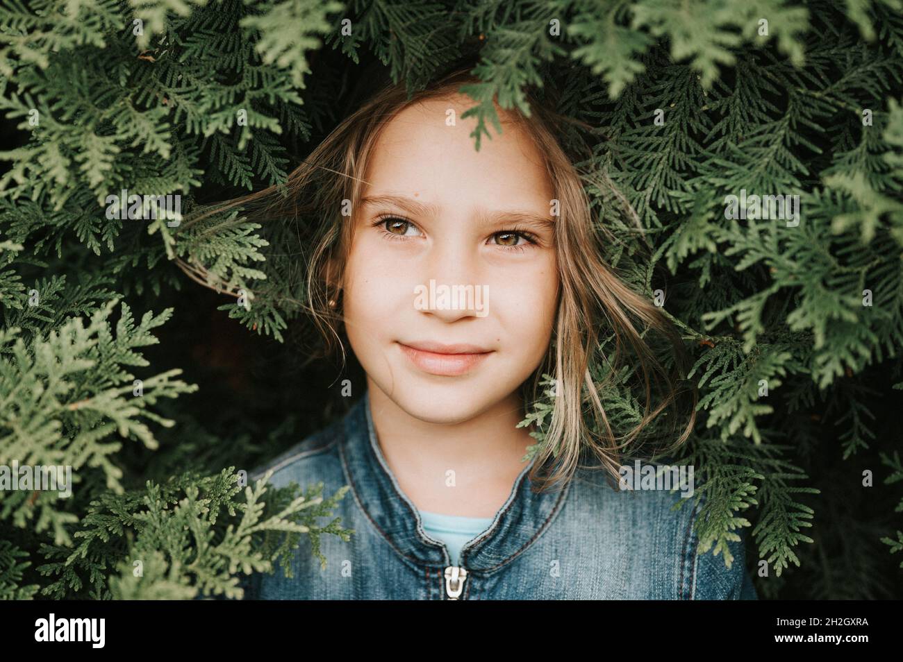 portrait of the face of a cute happy caucasian candid healthy eight ...