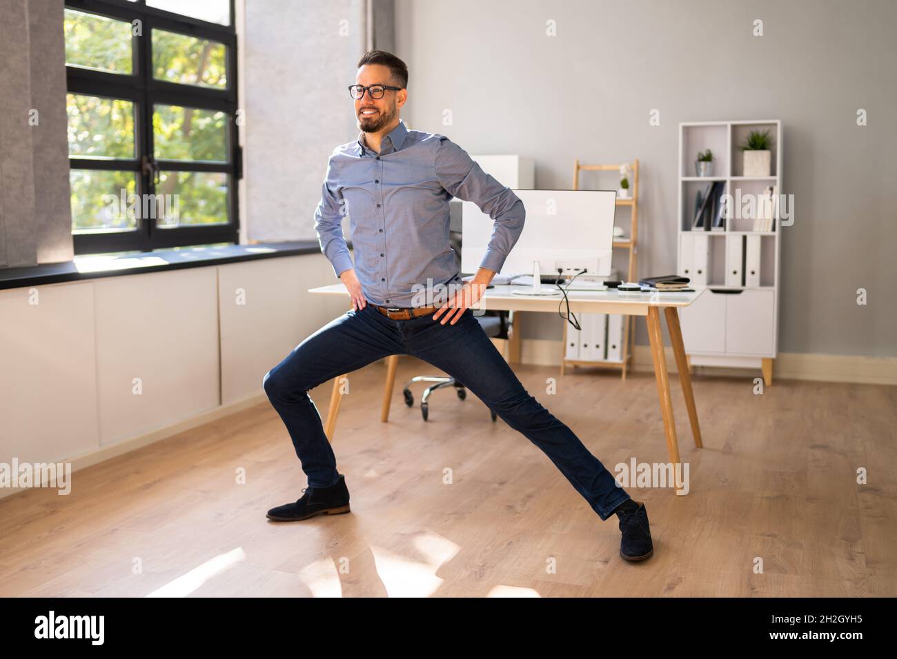 Man squat stretch hi-res stock photography and images - Alamy