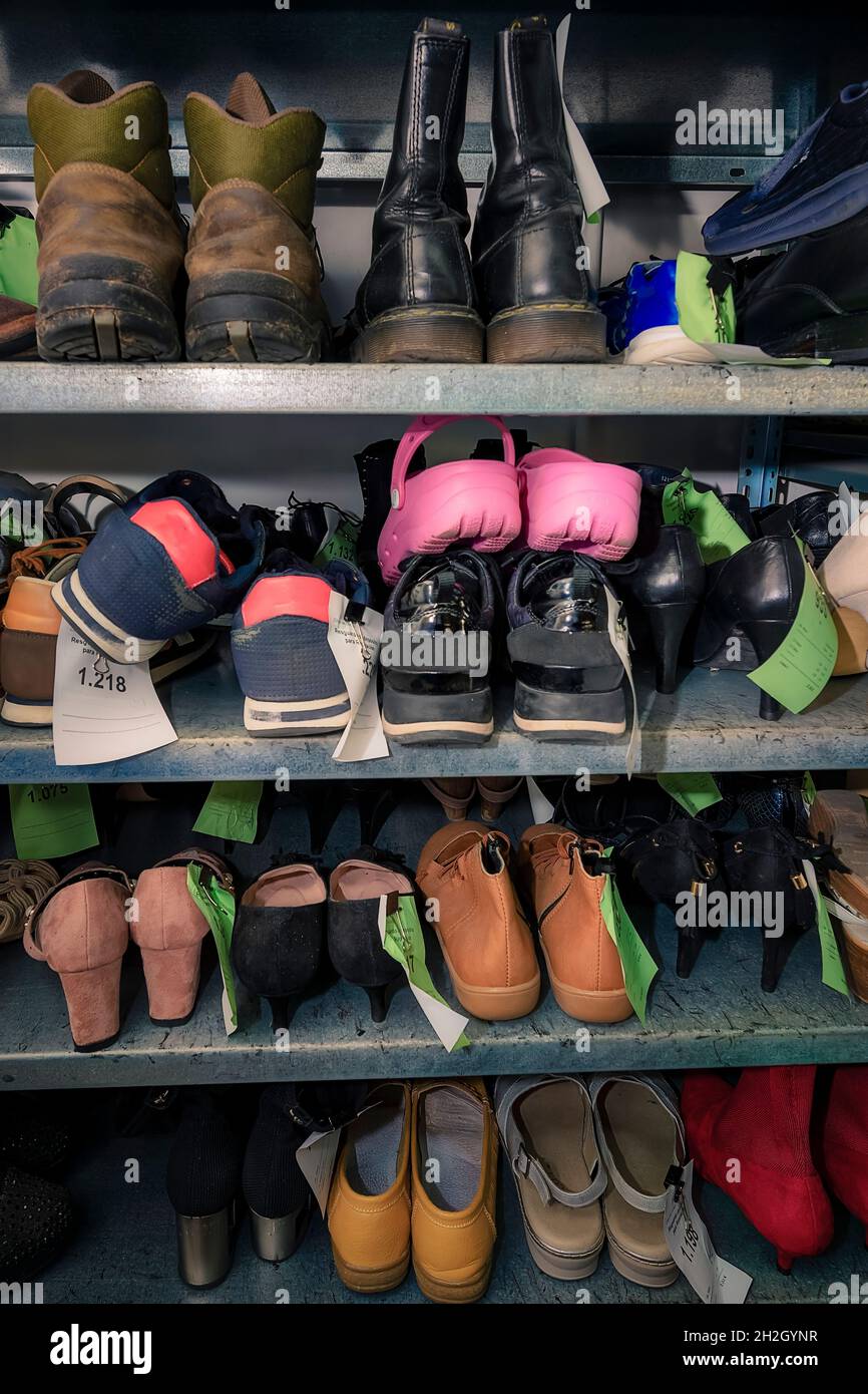 Shoes in repair shop, stacked and sorted Stock Photo - Alamy