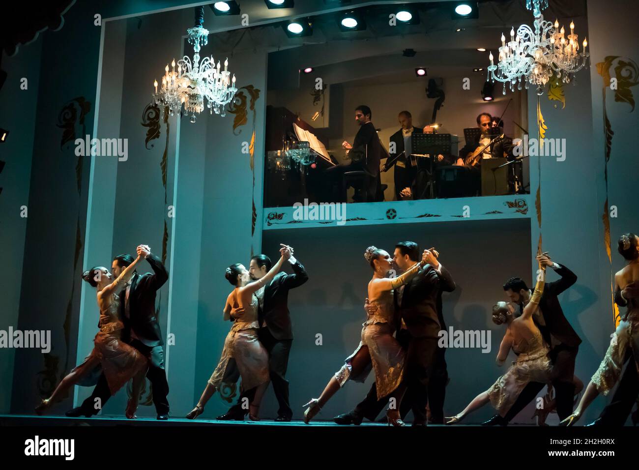 Horizontal shot of a group of dancers in a tango performance, with ...